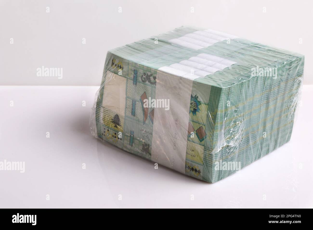 A stack of Lebanese pounds, 100,000 denomination, symbolizing the ...