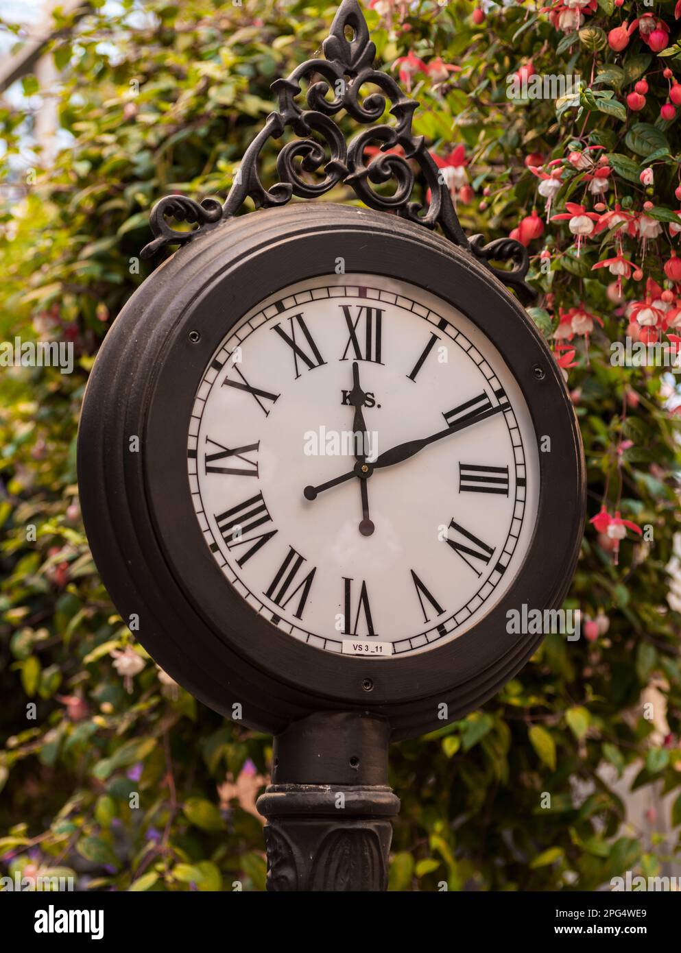 oldfashioned railway station clock pointing ten past noon Stock Photo ...