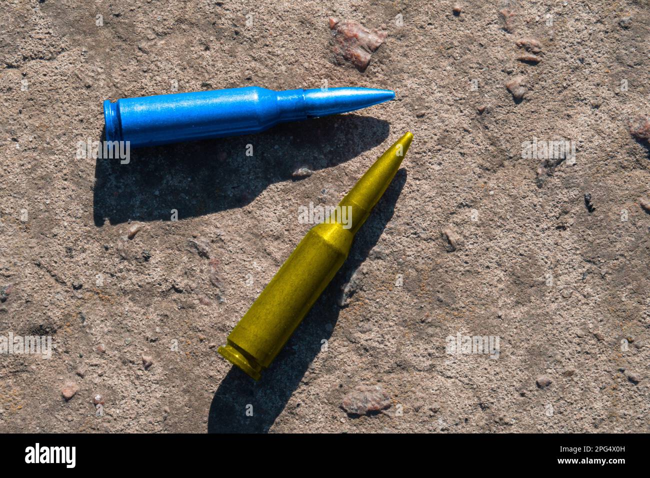 Yellow and blue rifle cartridges (the national symbol of Ukraine) lie ...