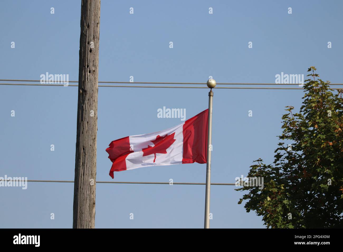 Canadian flag flying hi-res stock photography and images - Alamy
