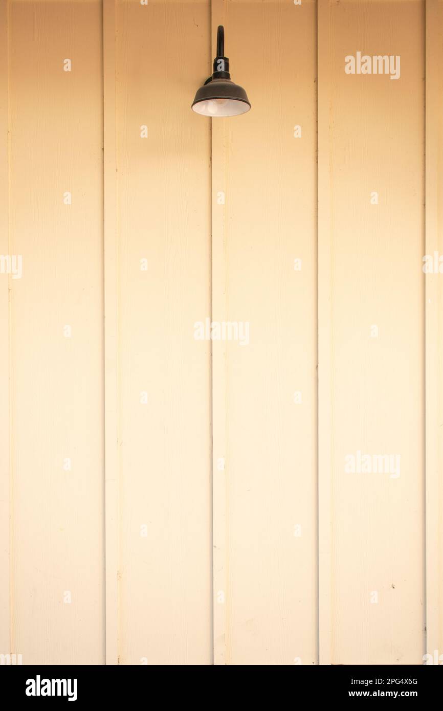Cream batten accent wall overhead lighting Stock Photo - Alamy