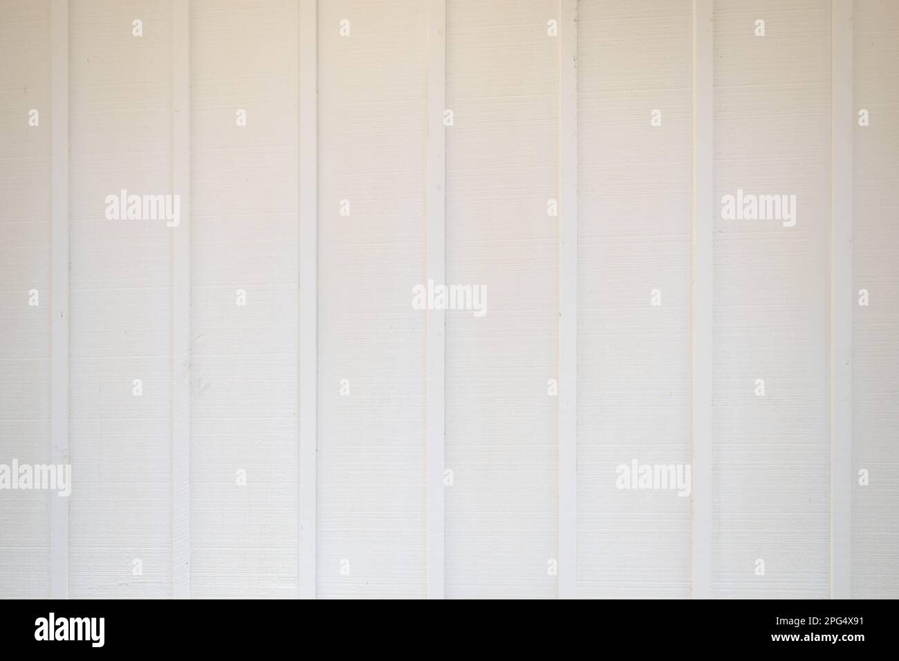 Batten accent white wood wall Stock Photo - Alamy