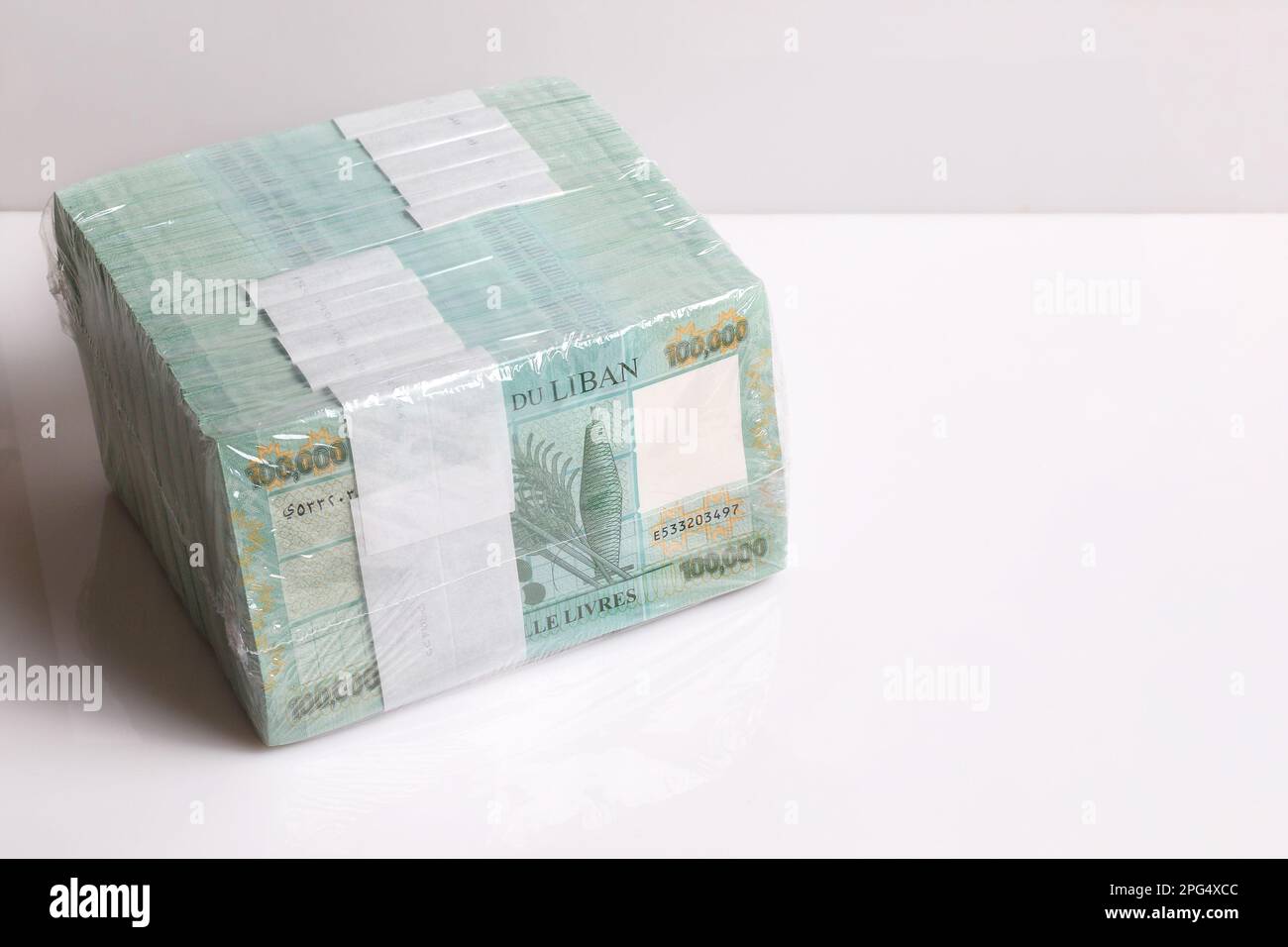 A stack of Lebanese pounds, 100,000 denomination, symbolizing the ...