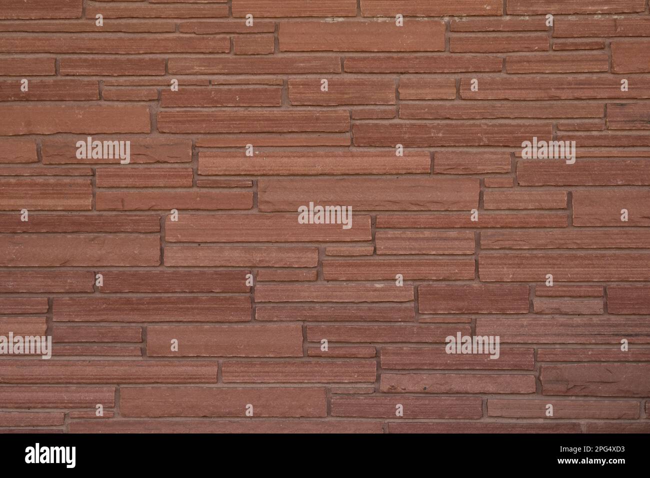 Thin red stone brick background Stock Photo - Alamy
