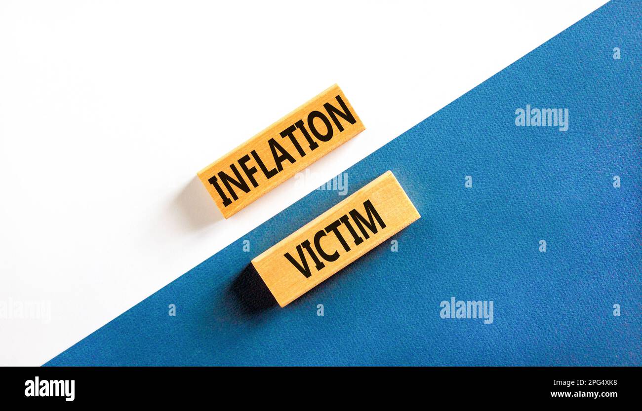Inflation victim symbol. Concept words Inflation victim on wooden block ...