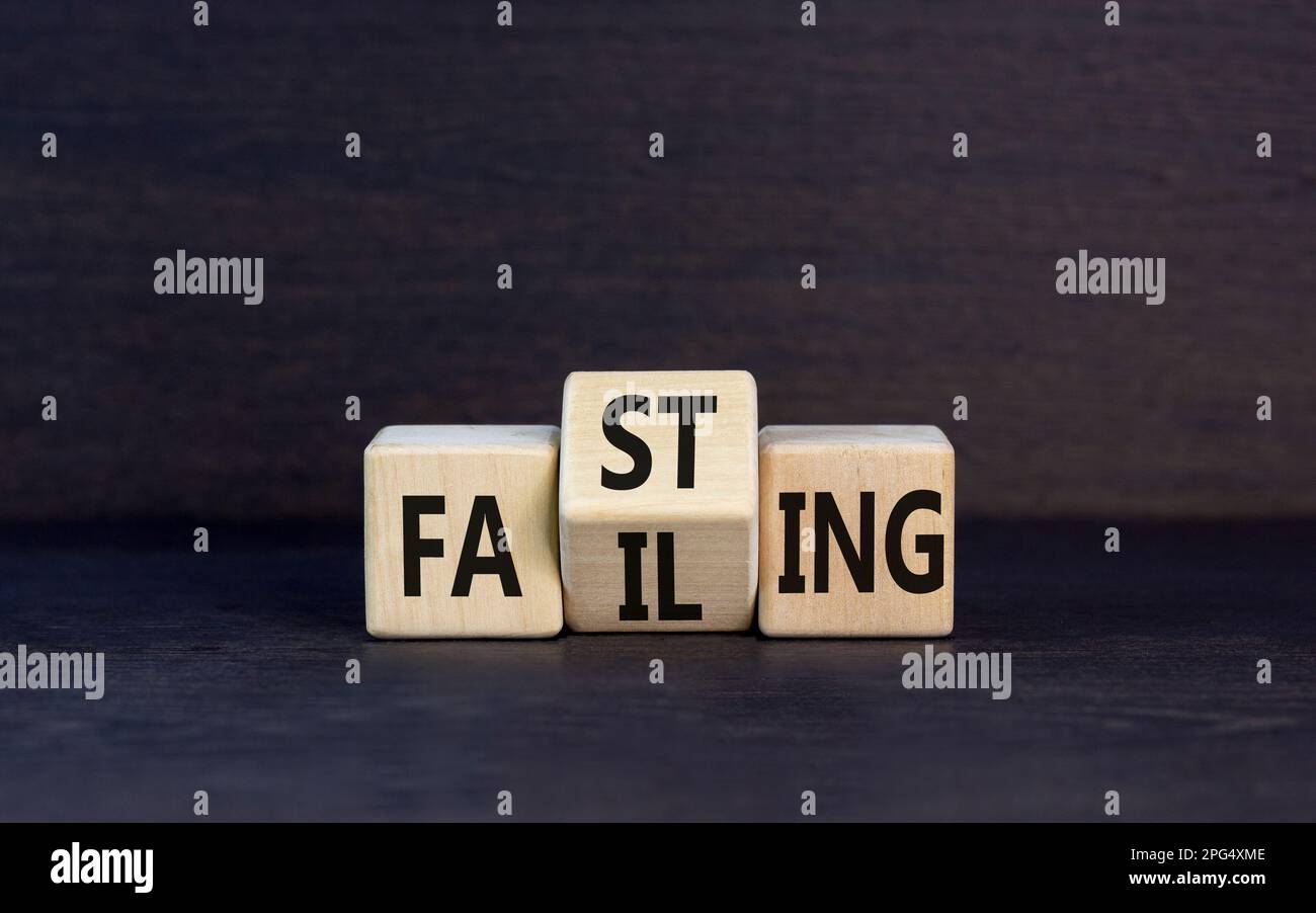 Fasting or failing symbol. Concept word Fasting Failing on wooden cubes ...