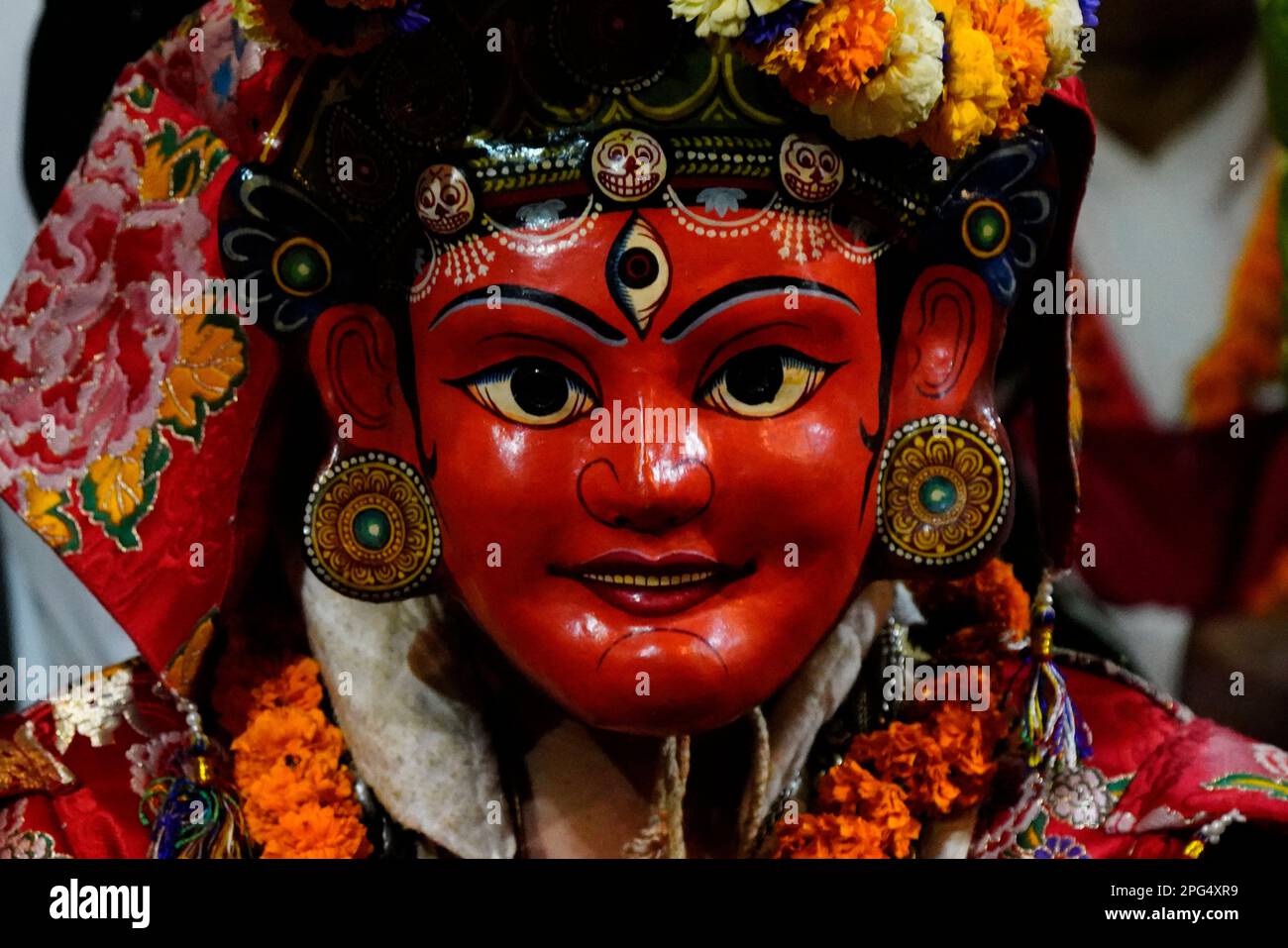 Kathmandu, Nepal. 20th Mar, 2023. A masked dancer walks before he ...
