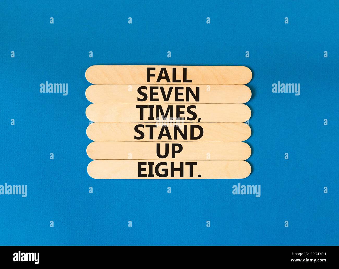 Stand up symbol. Concept words Fall seven times stand up eight on ...