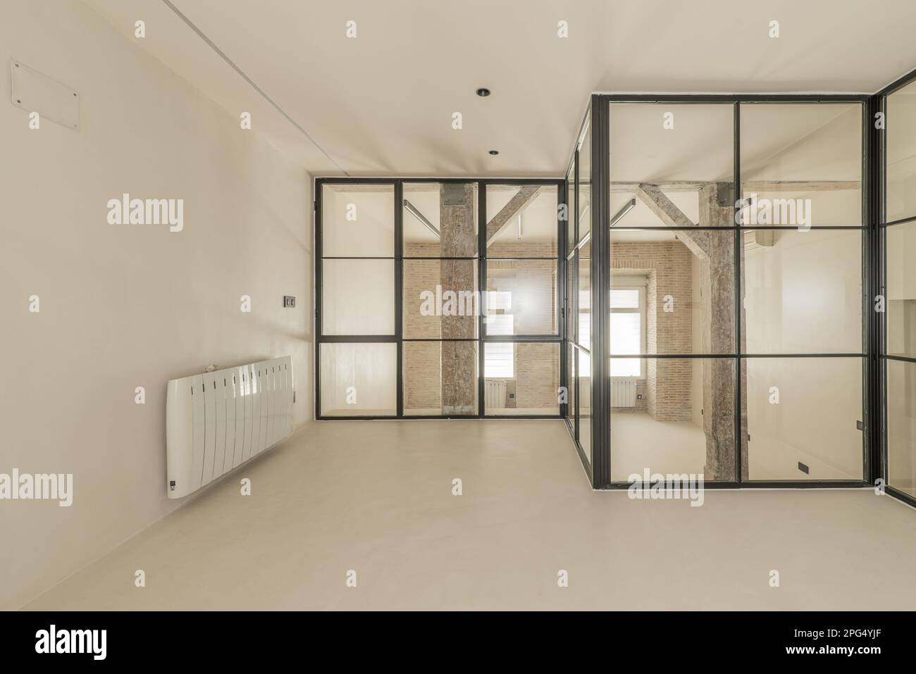 Modern loft apartment with old wooden beams and pillars, exposed brick ...