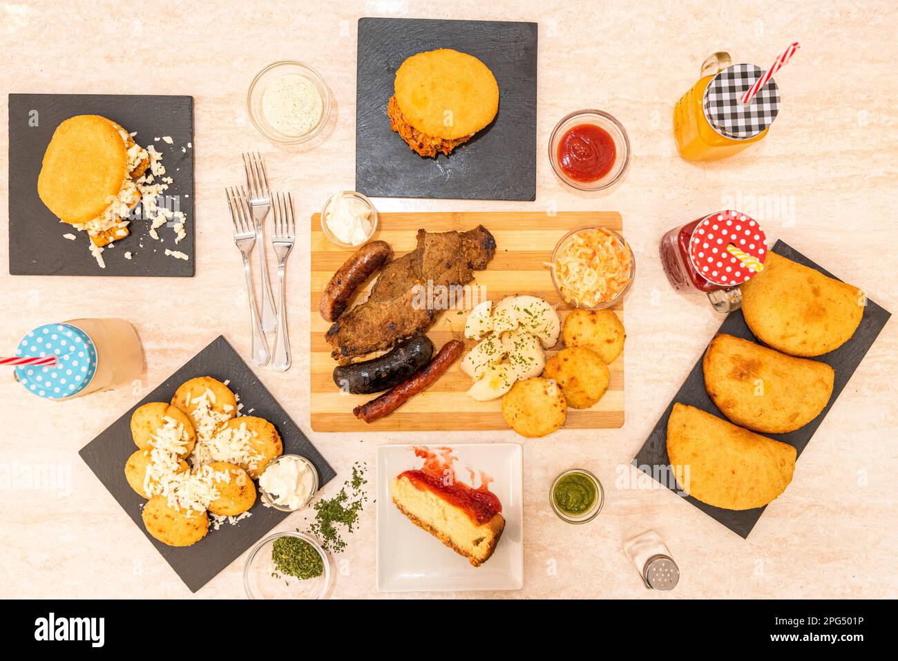 Set of black plates full of typical Colombian paisa food recipes, with ...