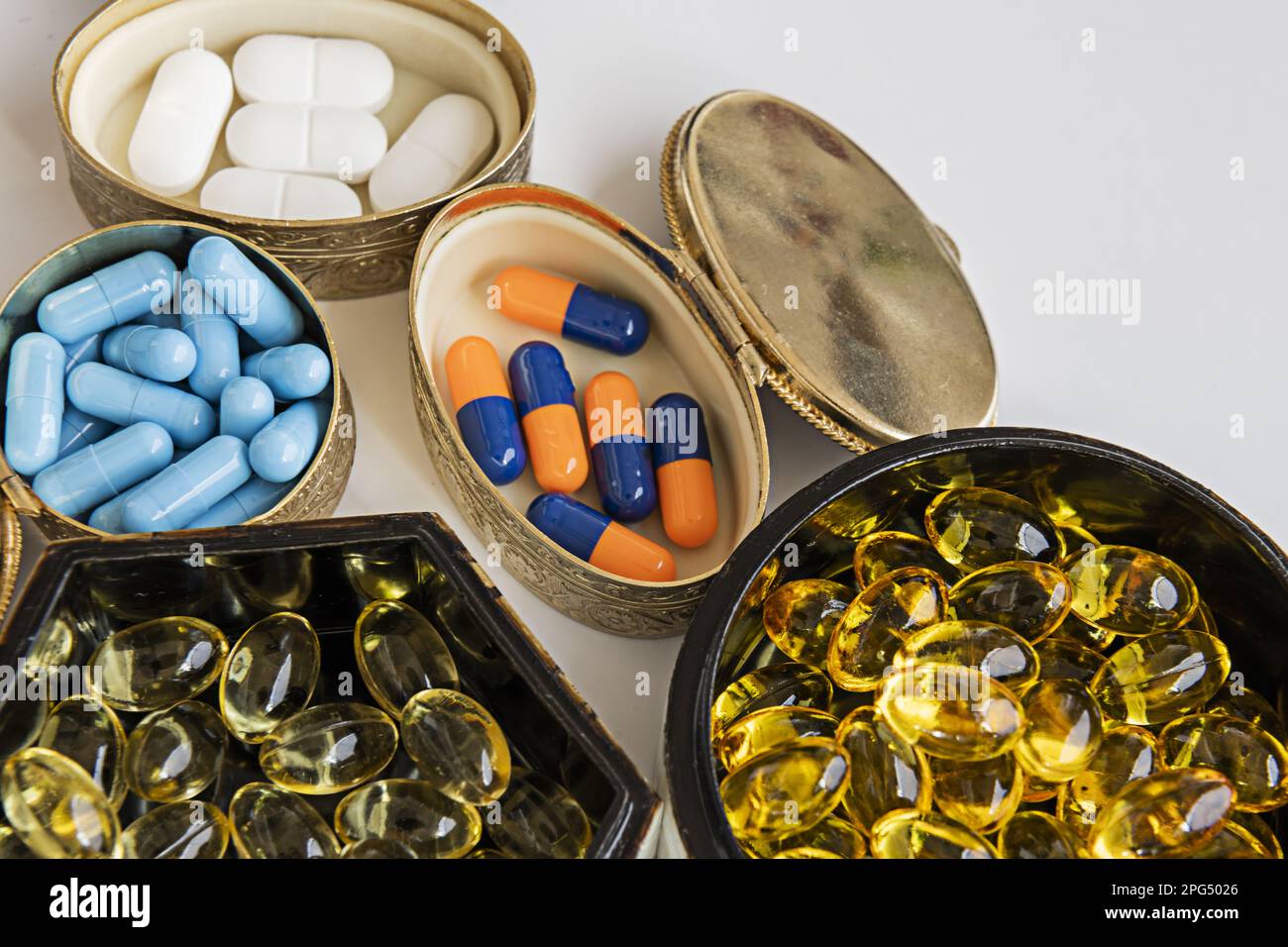 Pills of all kinds in small metal and plastic containers Stock Photo ...