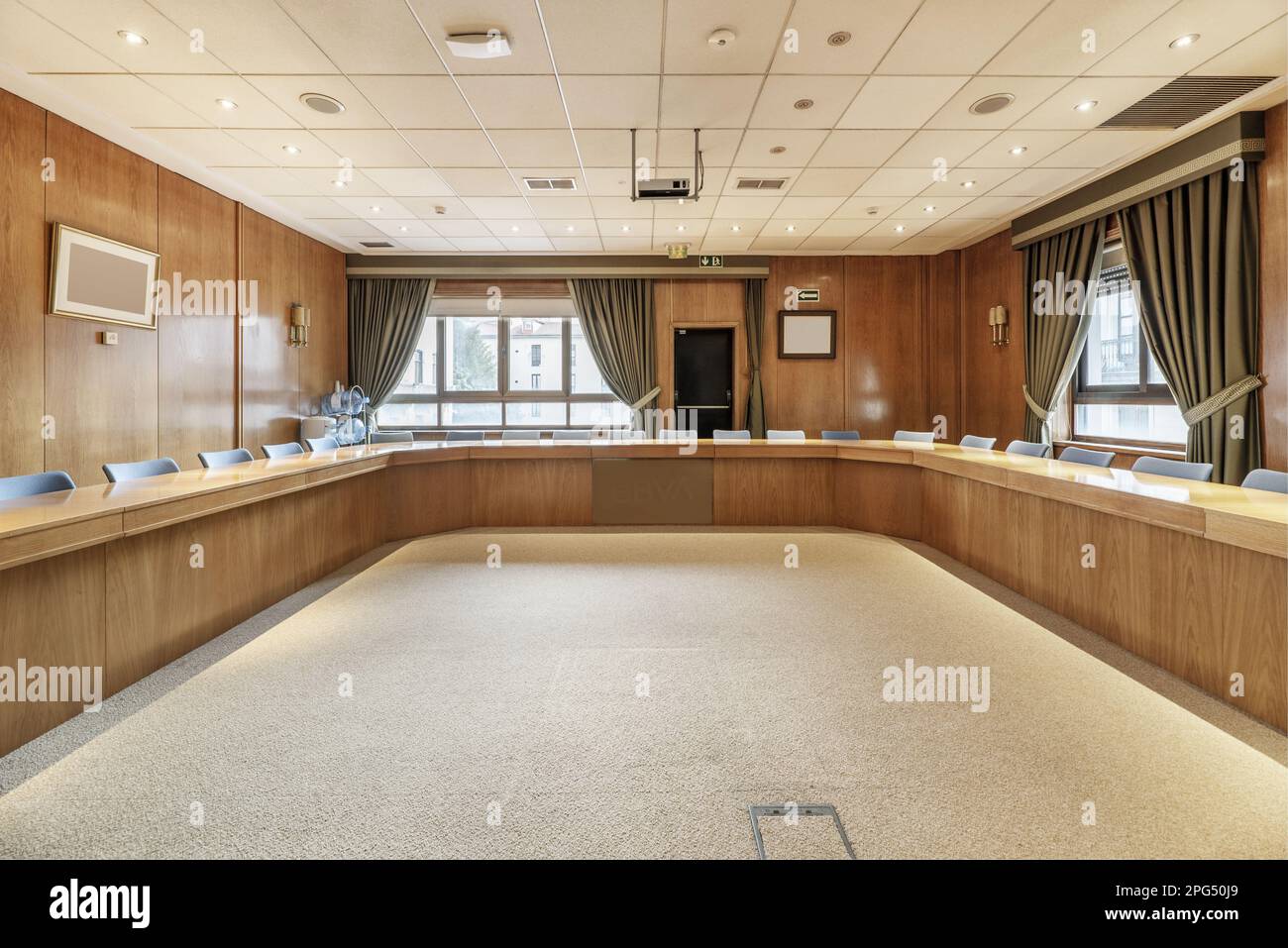 Meeting room of a company with a table running around the entire ...