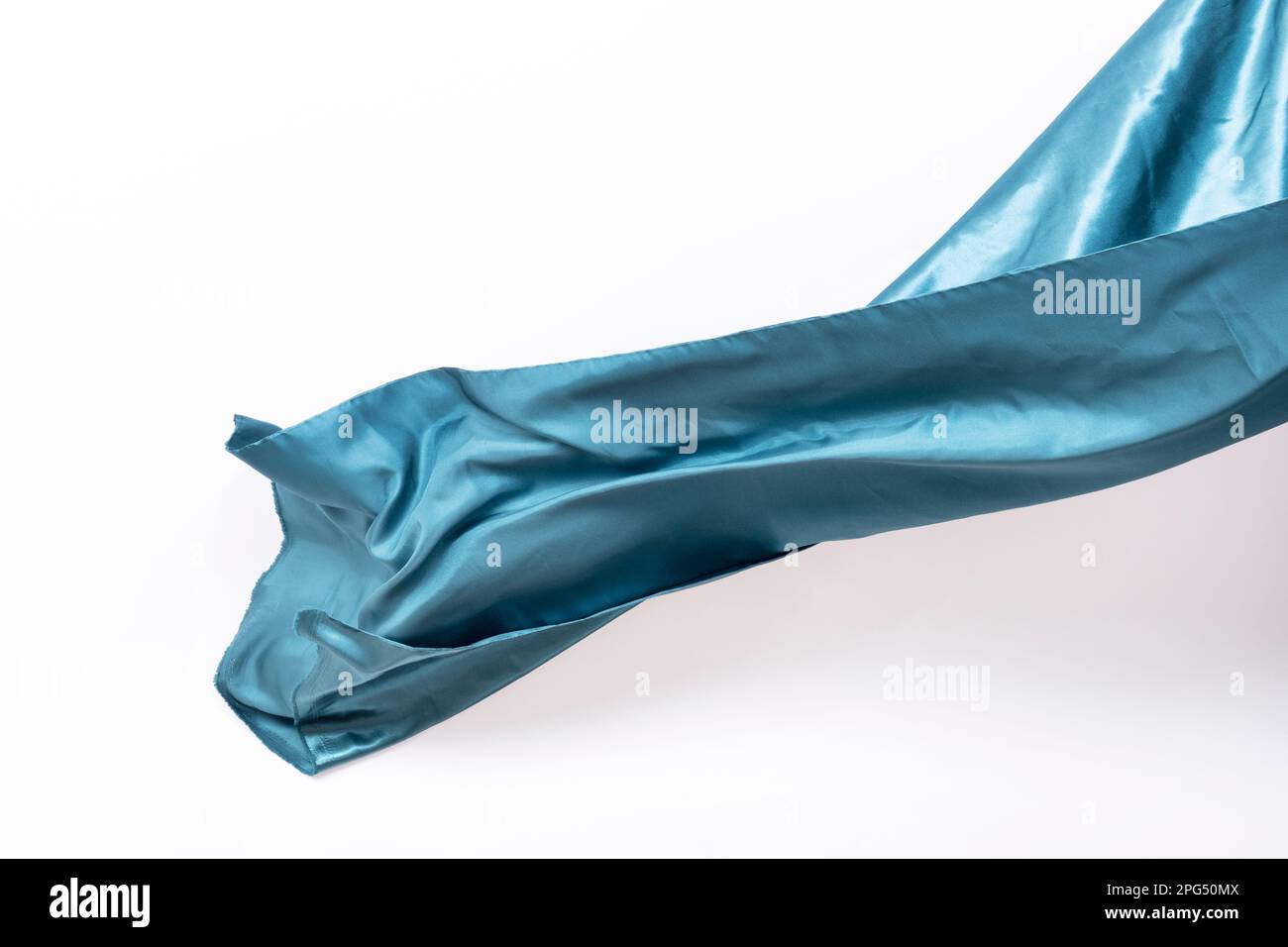 A large green satin cloth whipped through the air like a flag Stock ...