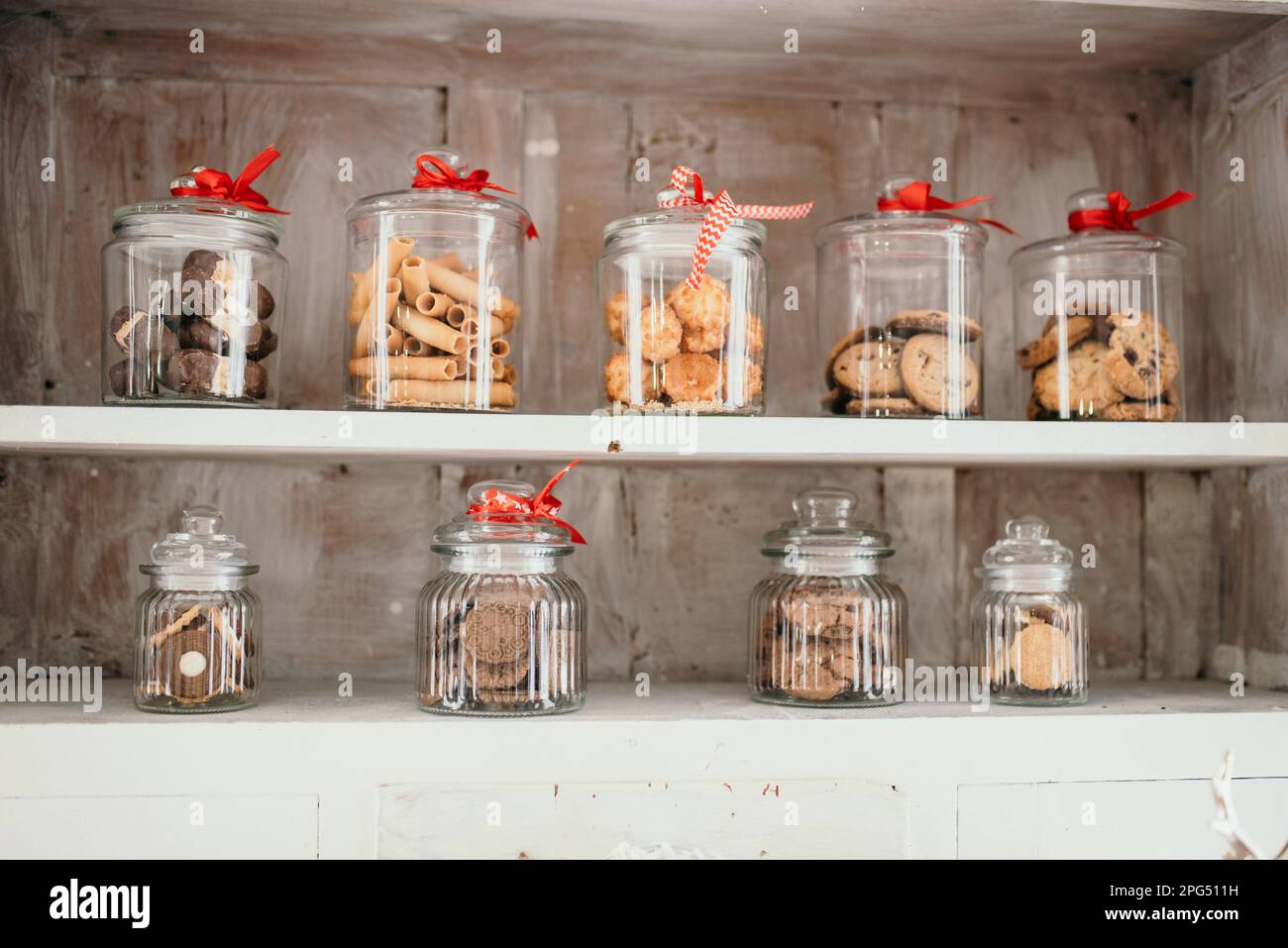 A festive holiday scene featuring Christmas cookies in jar in a ...