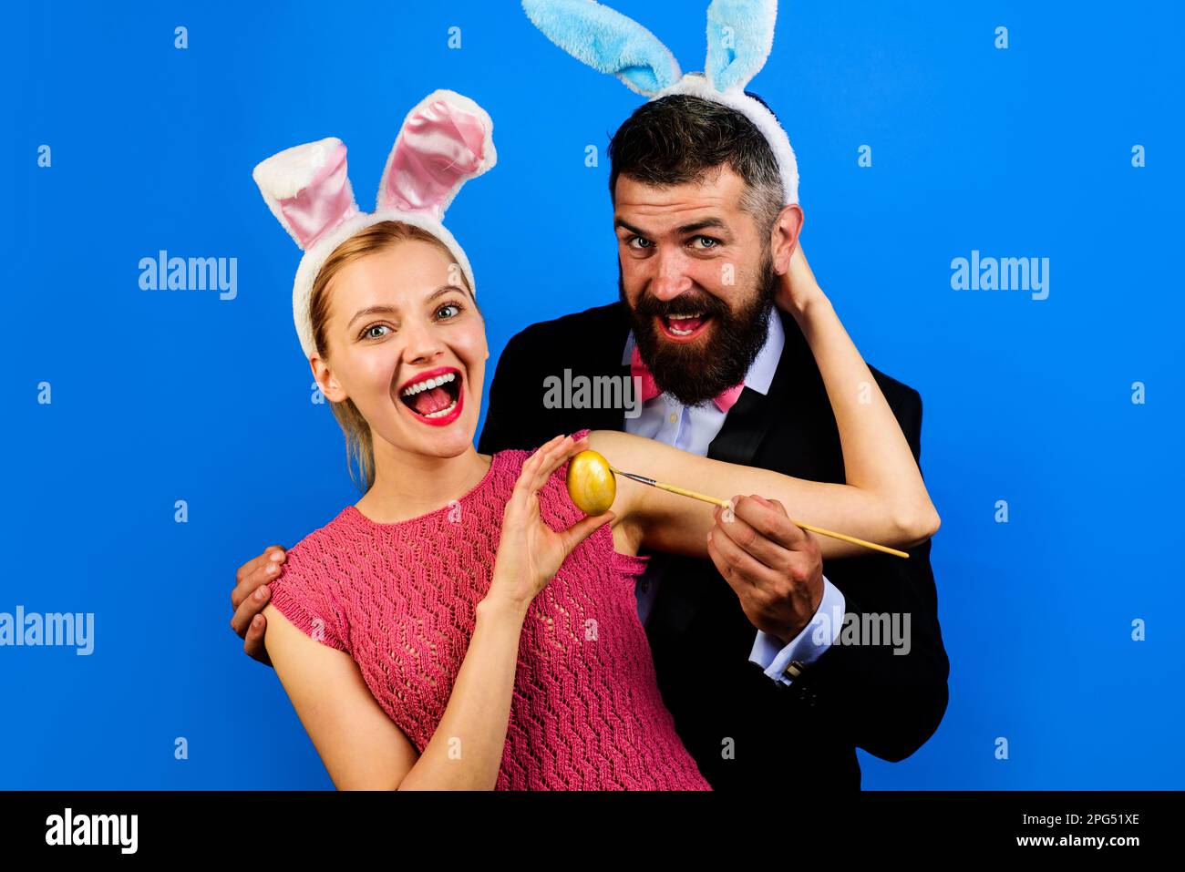 Easter day celebration. Happy couple wife and husband dye and decorate ...