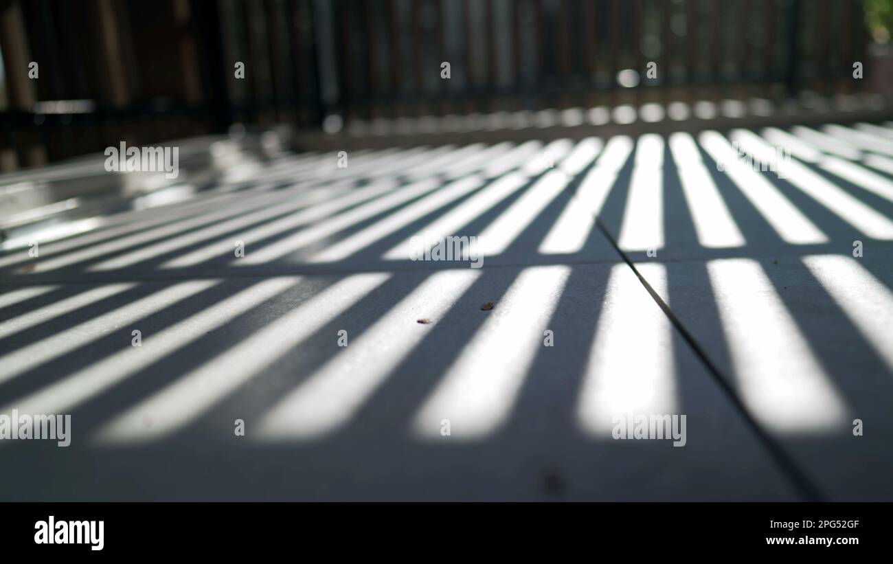 Sunlight patterns on floor at balcony terrace. Beuatiful day light ...