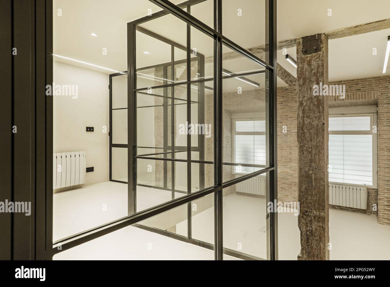 Loft-style apartment with vintage wooden beams and pillars, exposed ...