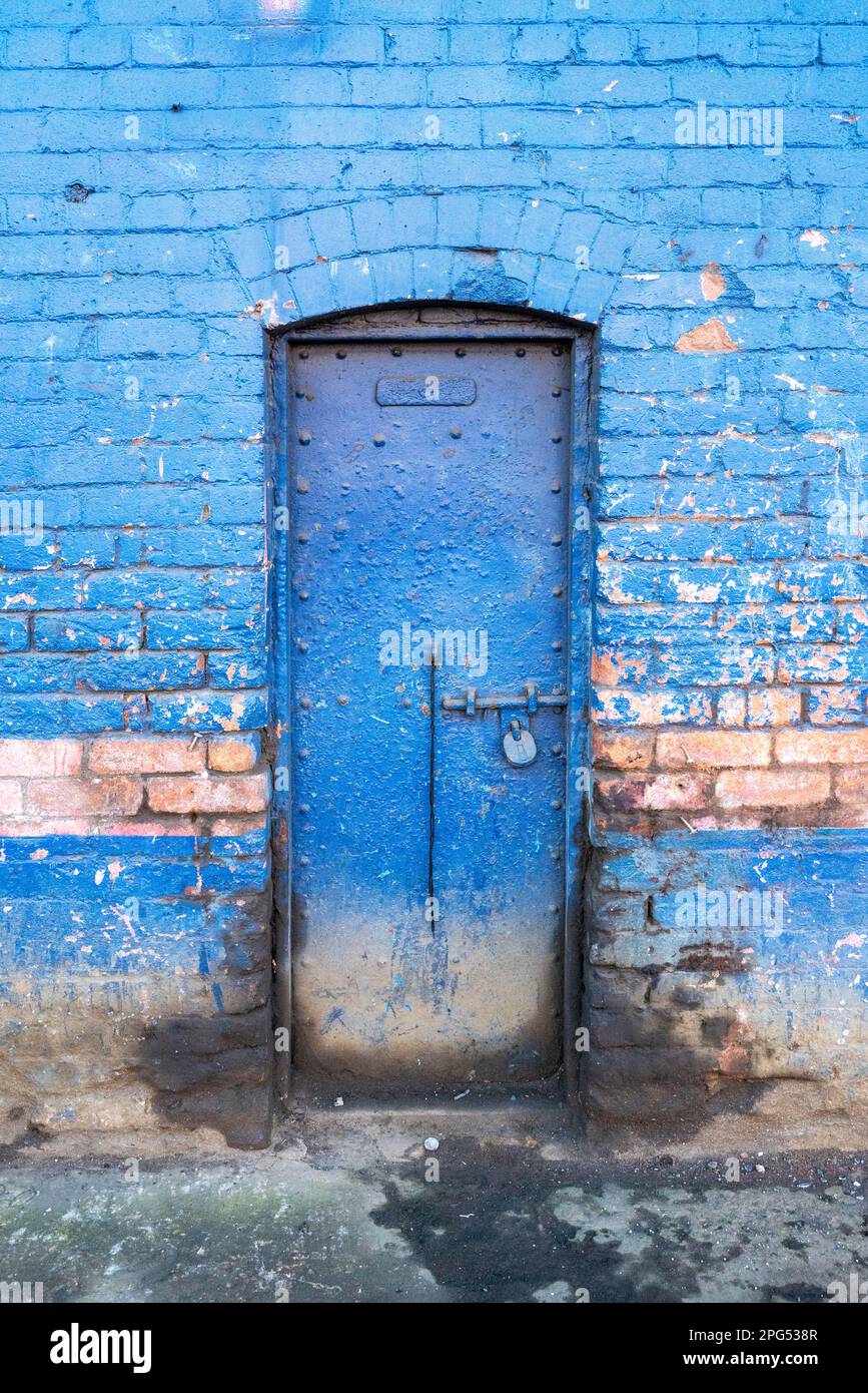Blue painted facade to Liverpool dockland warehouse Stock Photo - Alamy