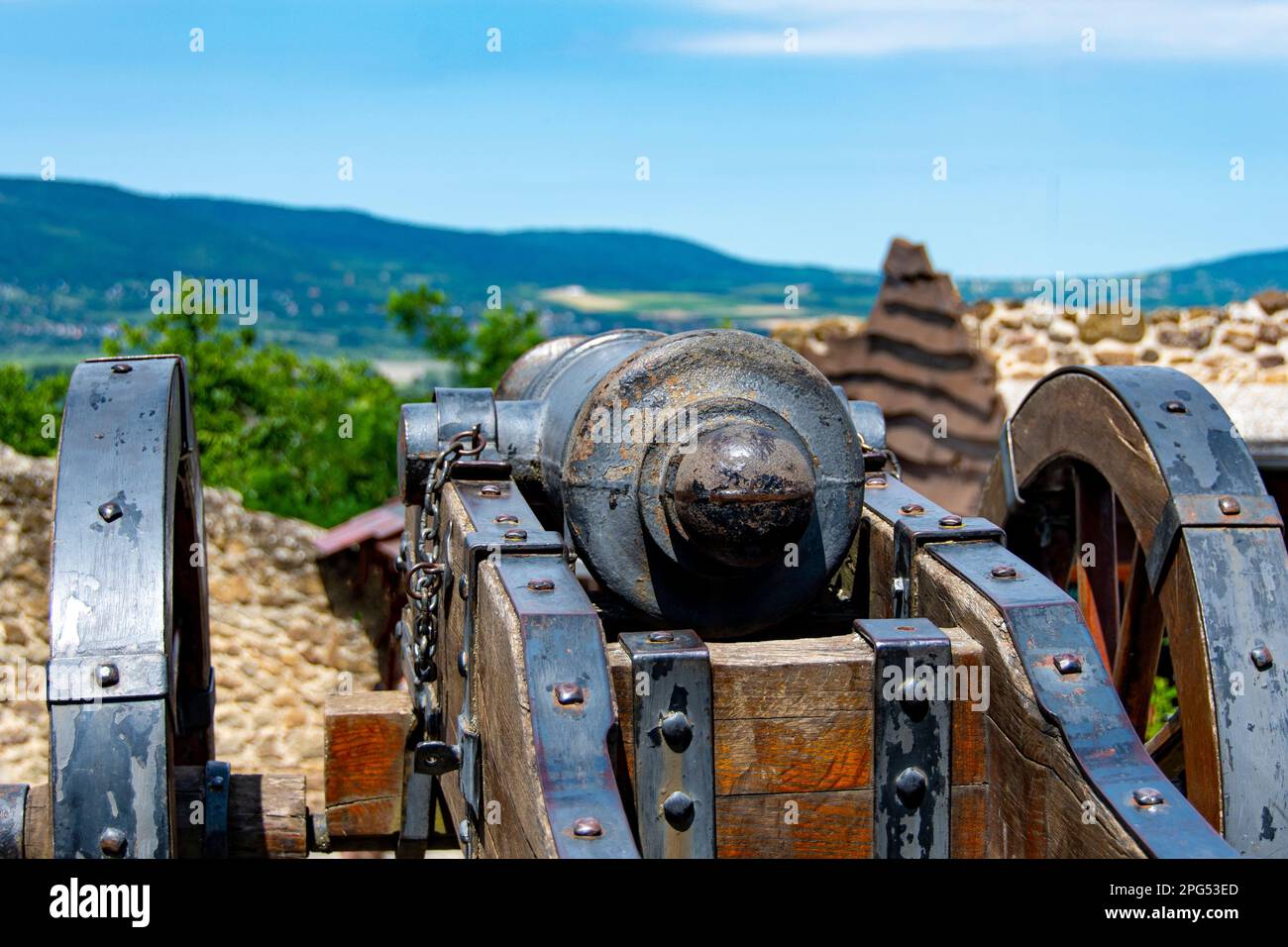 A patinated medieval cannon aimed at distant hills Stock Photo - Alamy