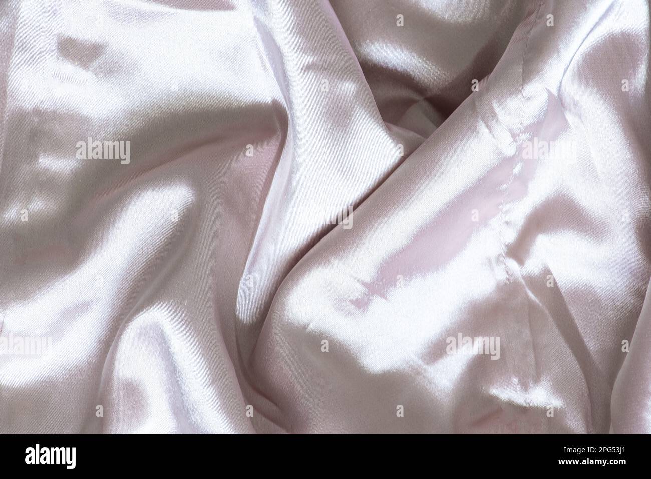 light plain silk fabric wrinkled as a background close-up, silk Stock ...