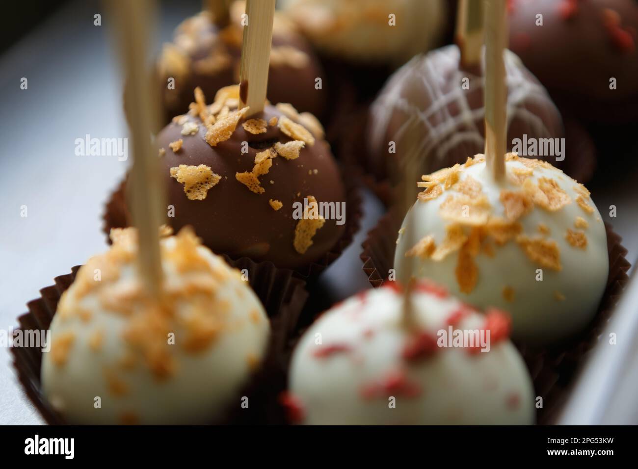 Delicious chocolate bon bon sweets on sticks prepared with Belgian milk ...