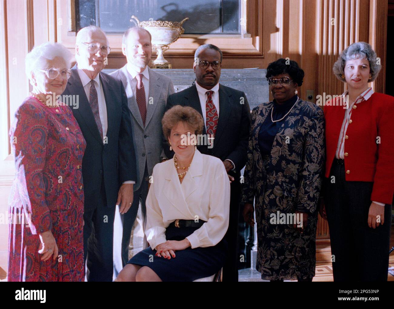 Supreme Court Justice Clarence Thomas, center, standing, and his wife ...