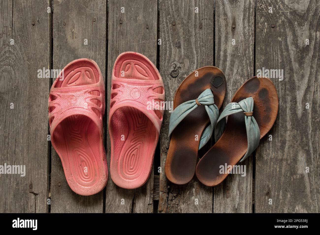 old dirty indoor shoes are on the floor of a house without people Stock ...