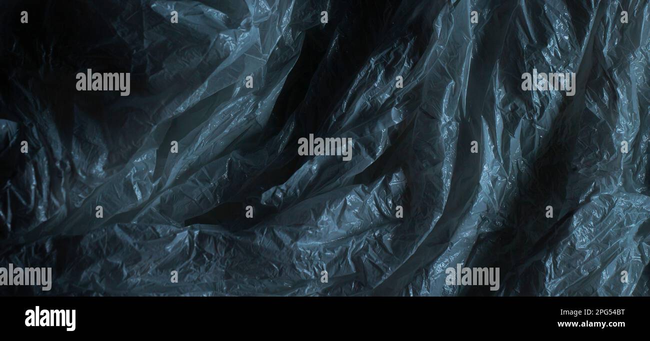 Dark gray plastic wrap background. Crumpled wrinkled plastic cellophane. Texture overlay effect ...