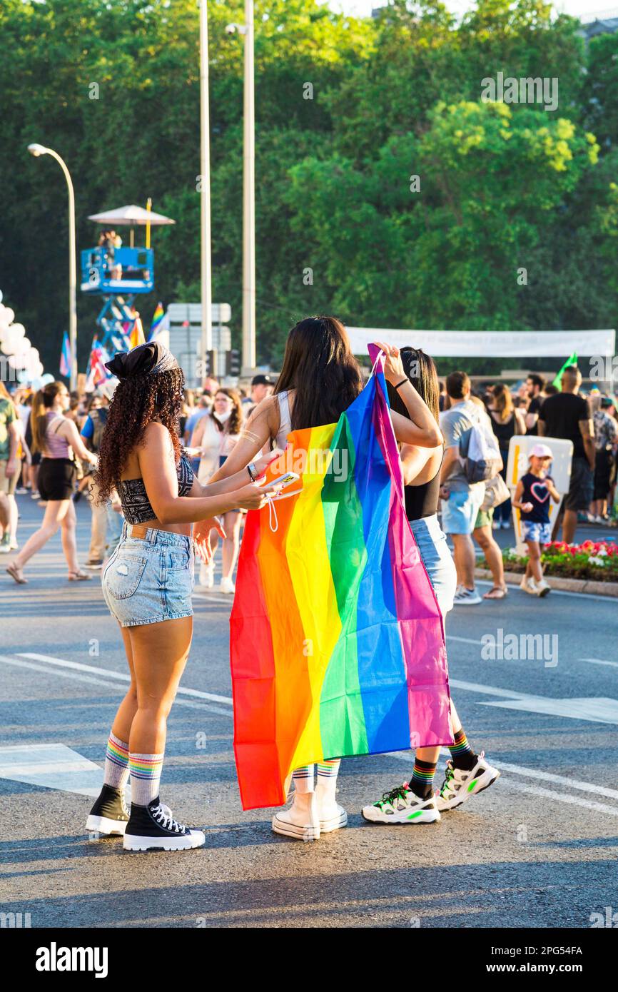 Group of friends dressed in the pride flag at the Pride. Sunny summer ...