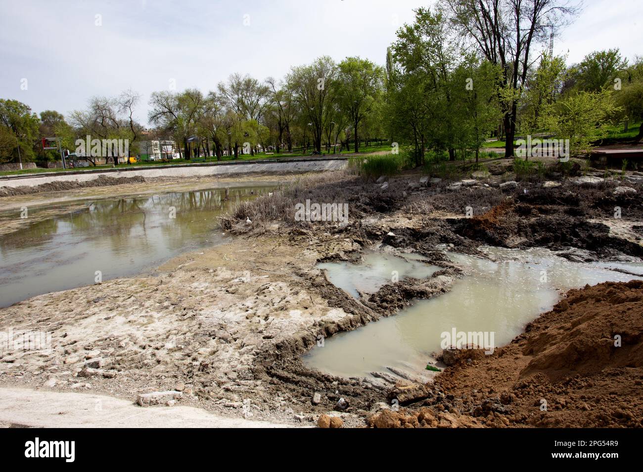 Ecological catastrophy. Drying lake in city park. Dry swamp lake ...