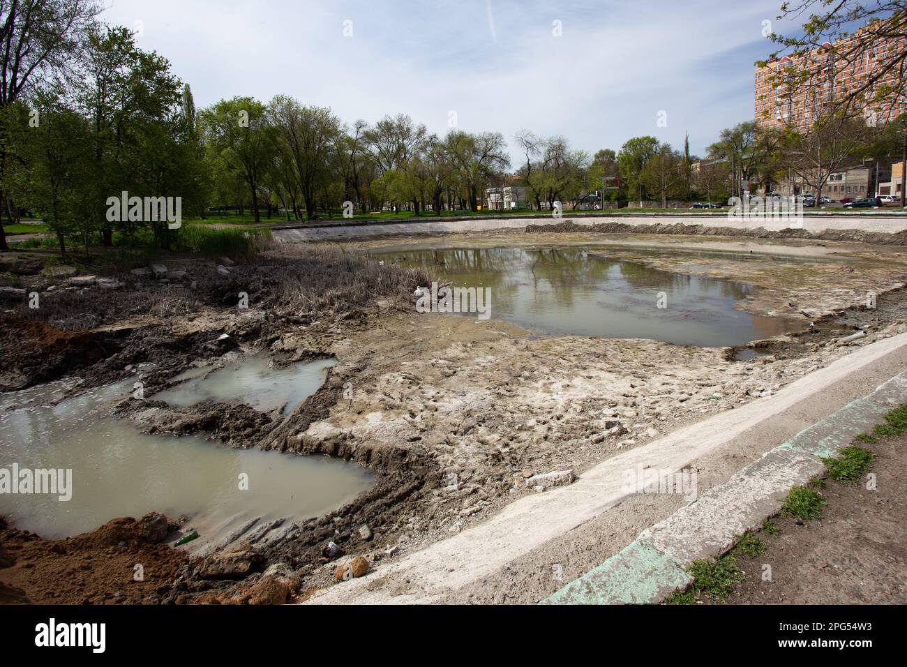 Ecological catastrophy. Drying lake in city park. Dry swamp lake ...