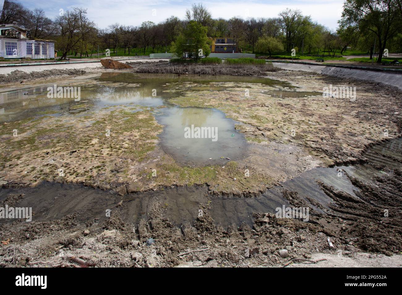 Ecological catastrophy. Drying lake in city park. Dry swamp lake ...