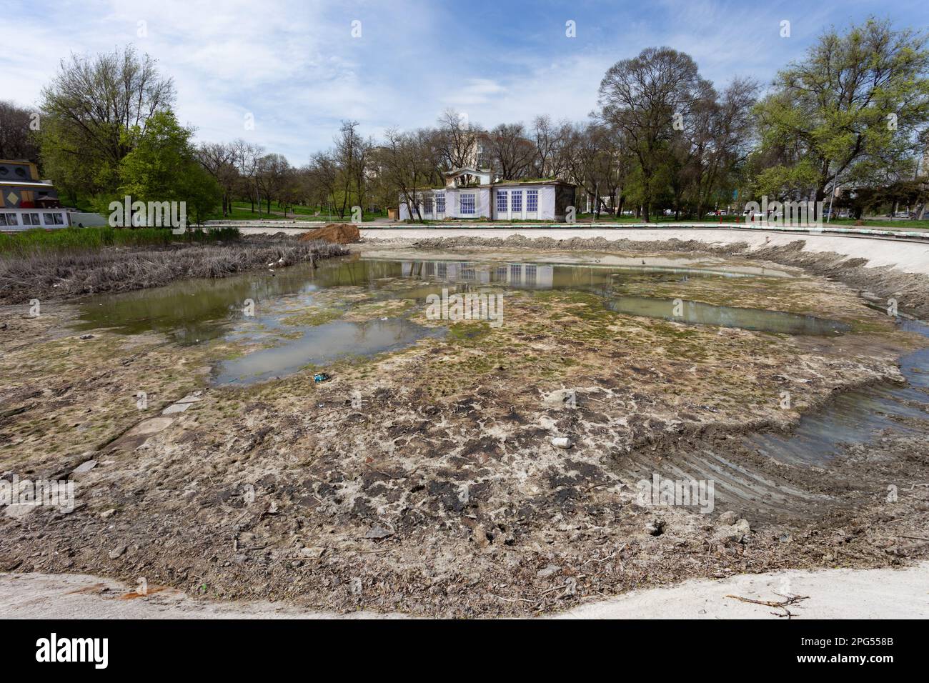 Ecological catastrophy. Drying lake in city park. Dry swamp lake ...