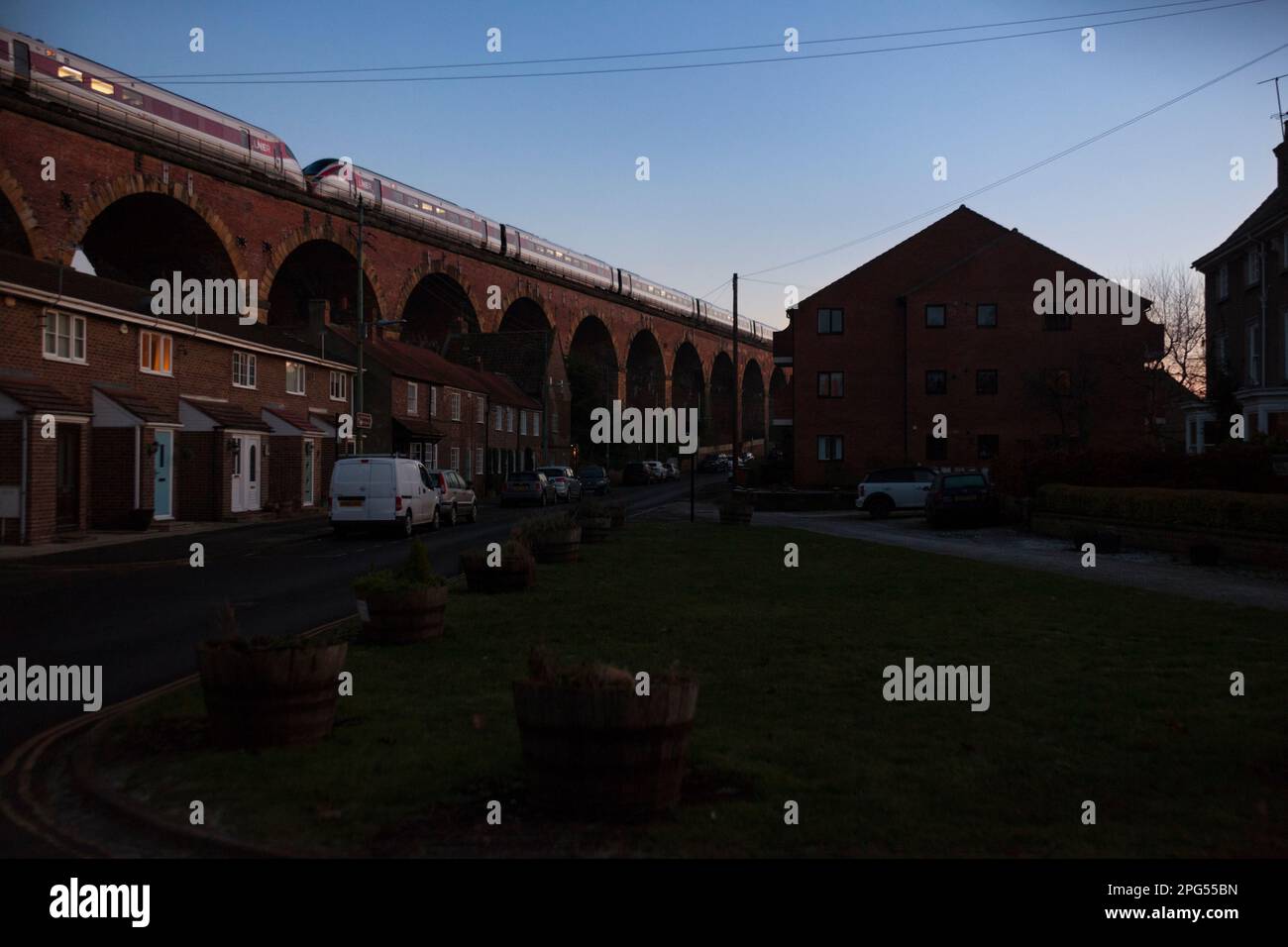 LNER Hitachi Azuma train crossing Yarm viaduct above a row of terraced ...