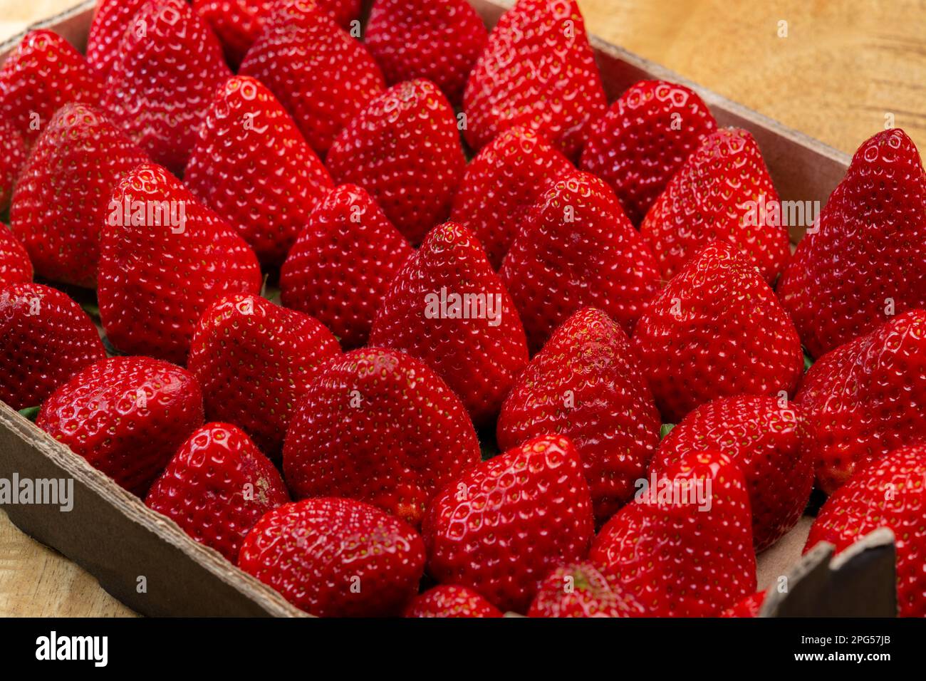 New harvest, 1 kilogram paper box of ripe red sweet Spanish strawberry ...