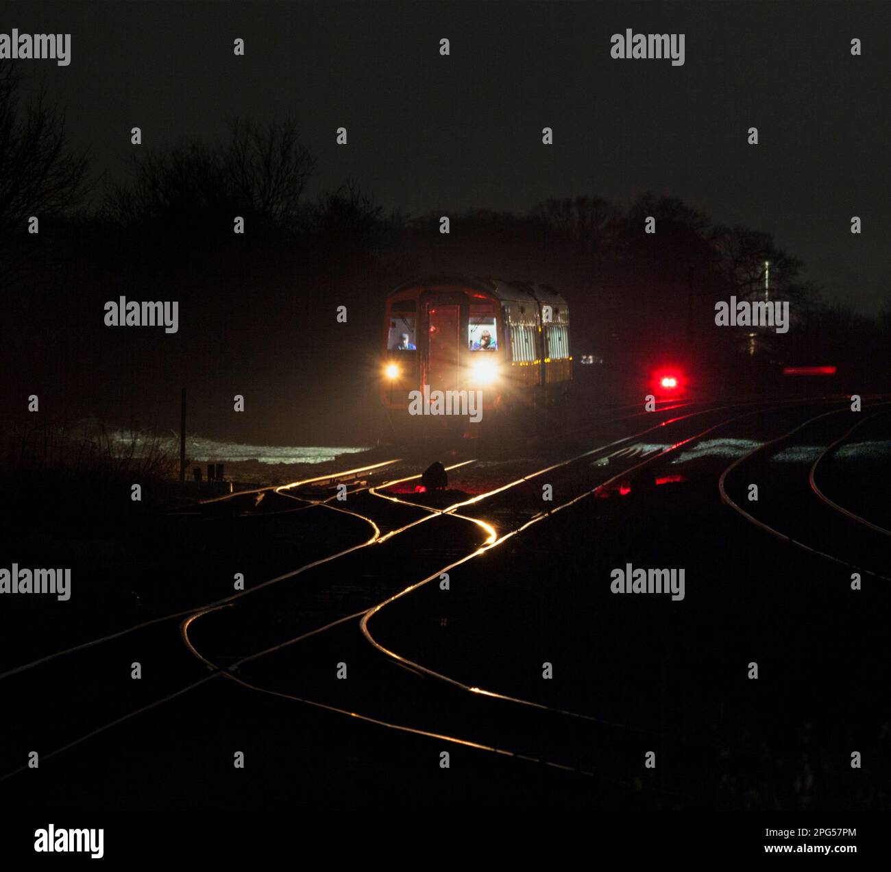 Northern Rail class 158 diesel trains headlights illuminating the track ...