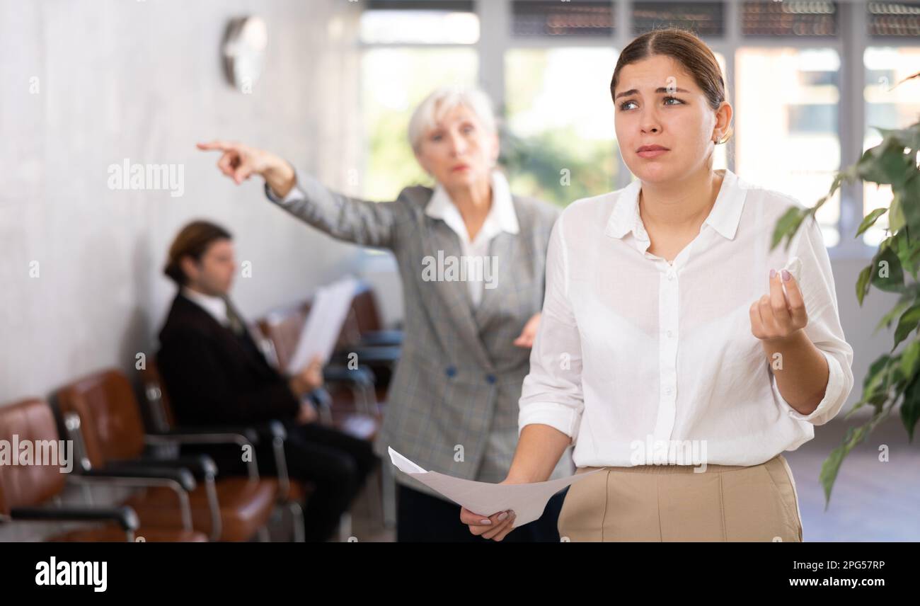 Crying young female office worker scolded by angry woman boss Stock ...