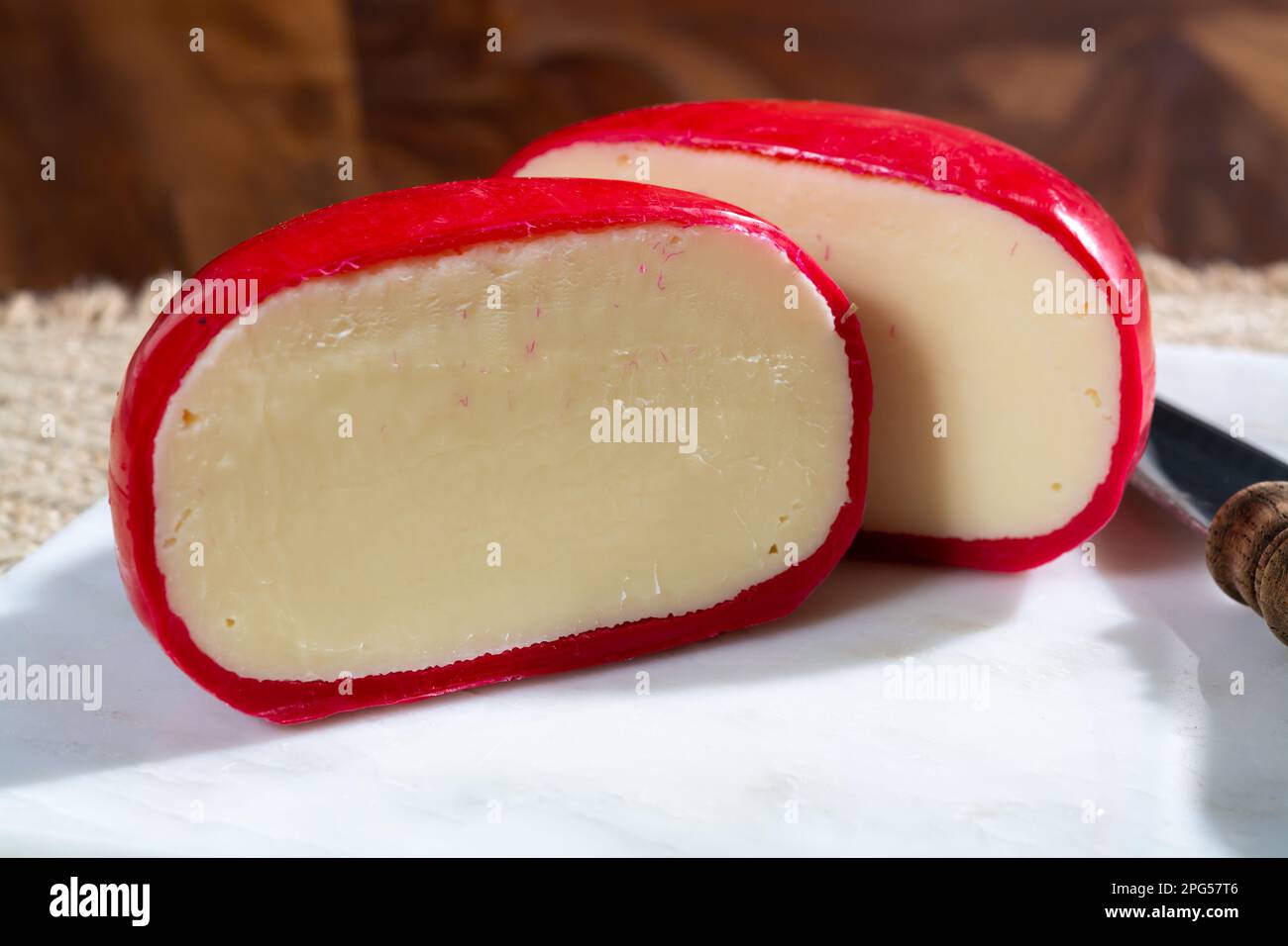 British red waxed original cheddar cheese madse from cow milk close up ...