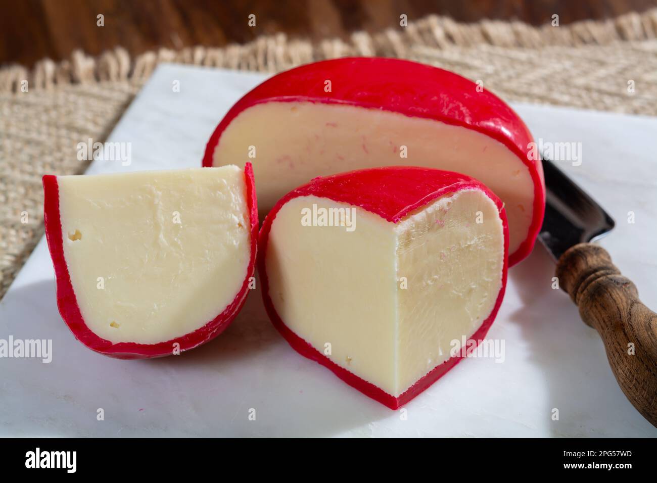 British red waxed original cheddar cheese madse from cow milk close up ...