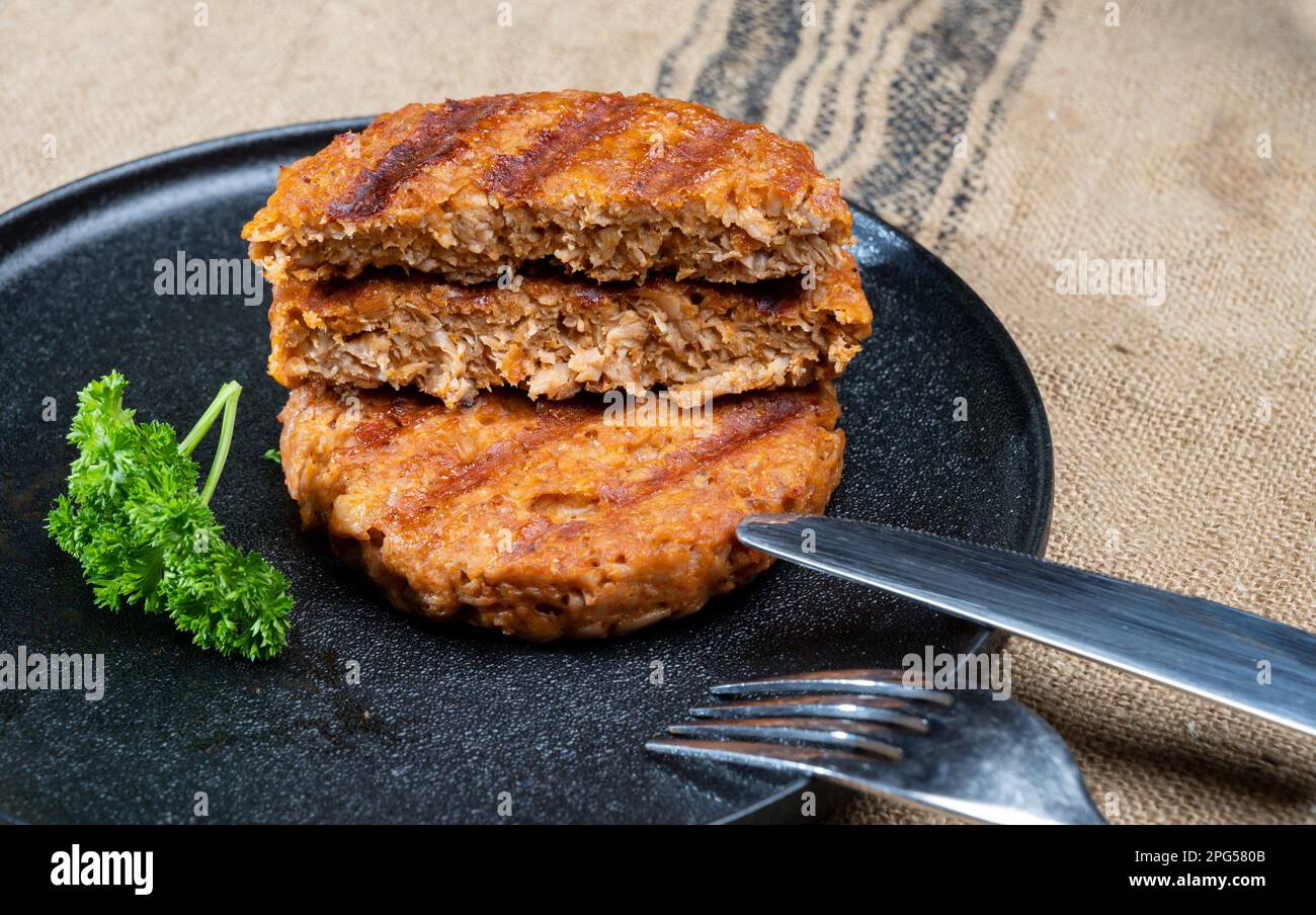Tasty grilled vegan burgers made from vegetarian plant based soya beans ...