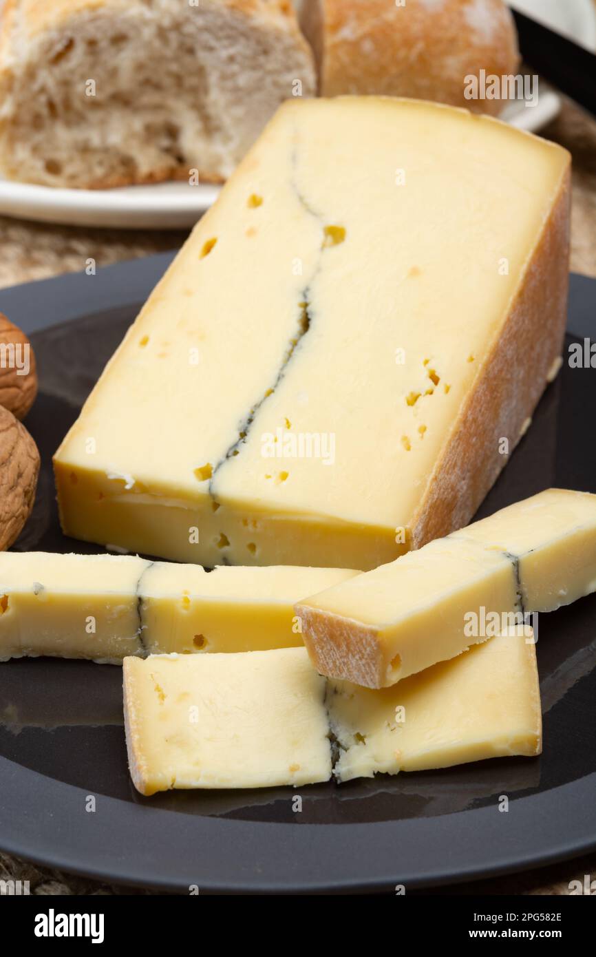 Cheese collection, French Morbier semi-soft cow milk cheese with black ...