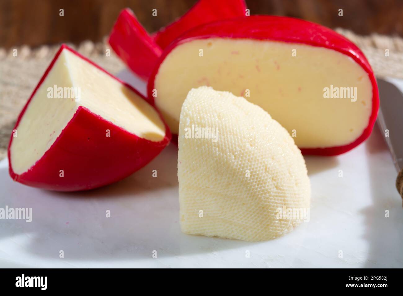 British red waxed original cheddar cheese madse from cow milk close up ...