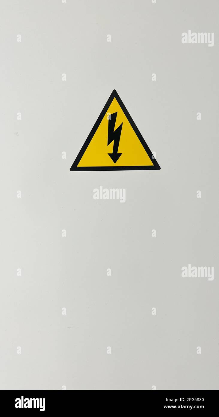 Yellow background black lightning symbol hi-res stock photography and ...