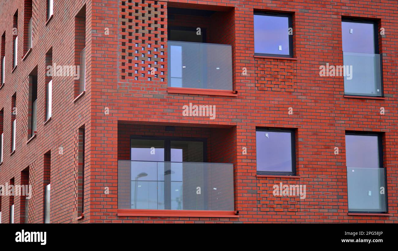 Modern apartment building for residential living in red brick stone ...