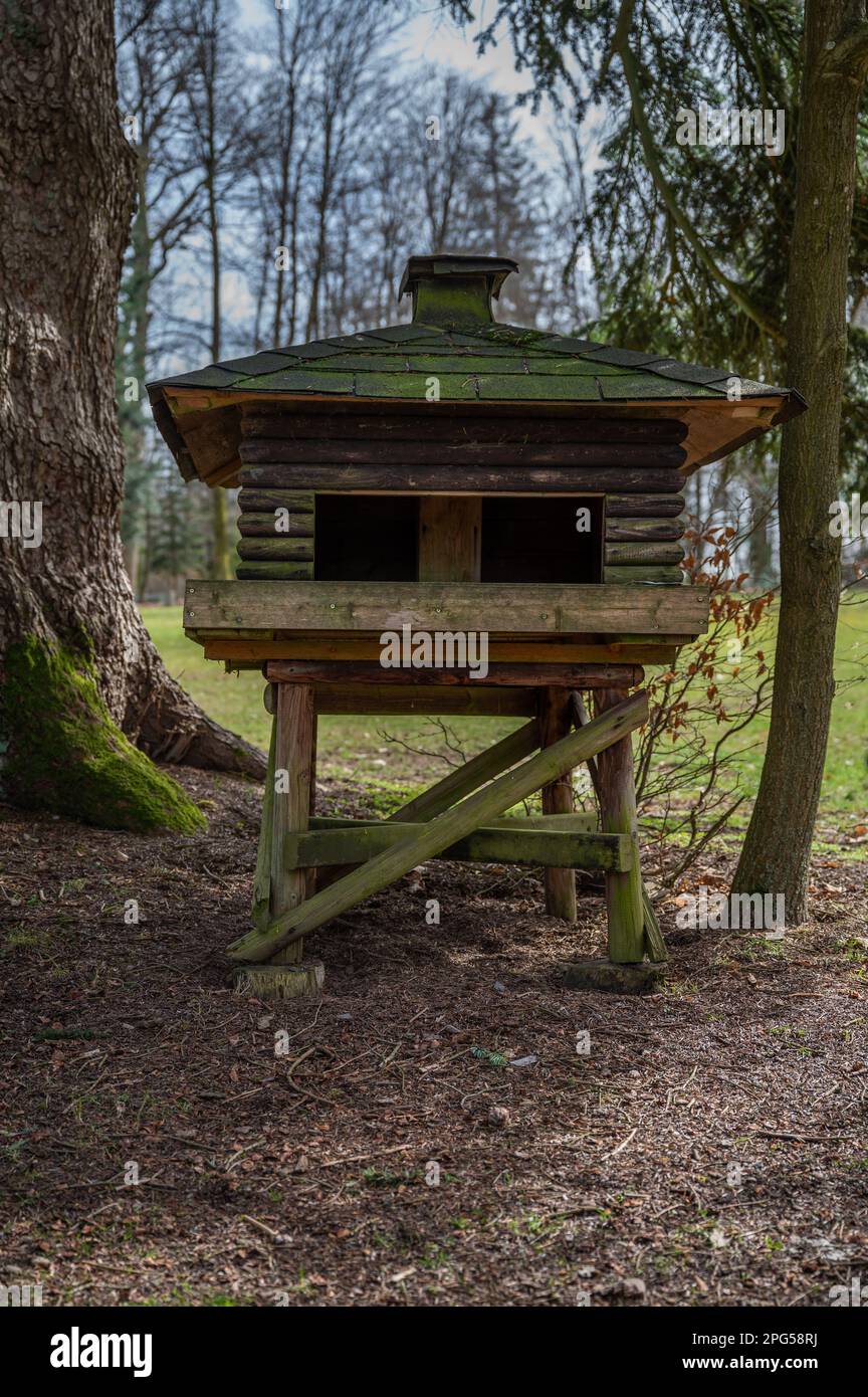 Large massive Bird house made of wood underneath a tree at Englischer ...