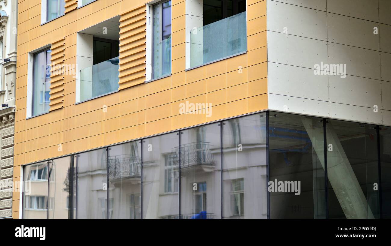 Details of facade made of aluminum panels, concrete and glass on ...