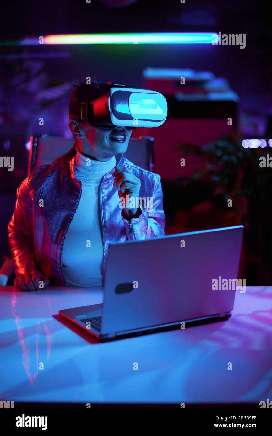 Neon metaverse futuristic concept. smiling trendy woman in vr headset ...
