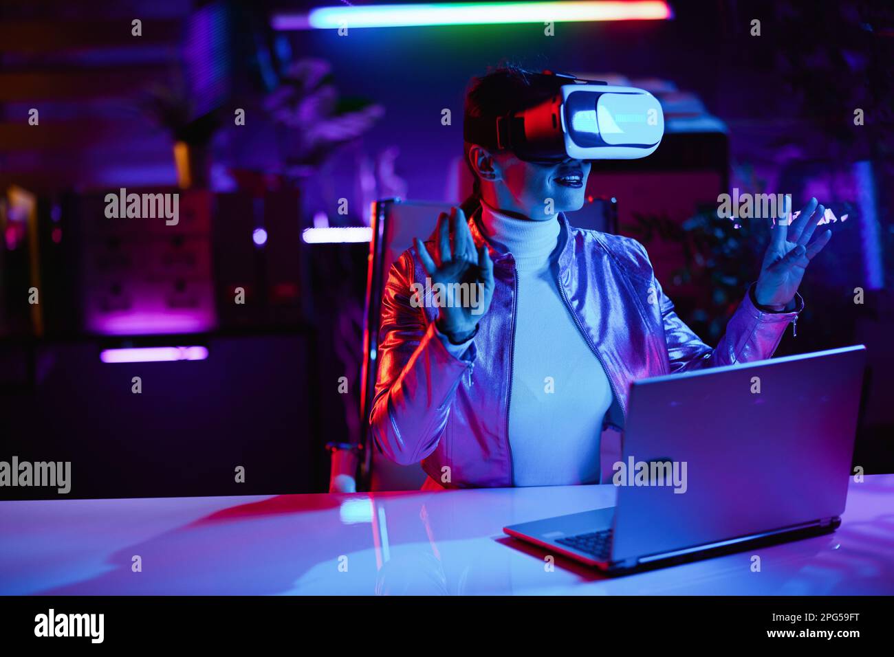 Neon metaverse futuristic concept. happy modern middle aged woman in ...