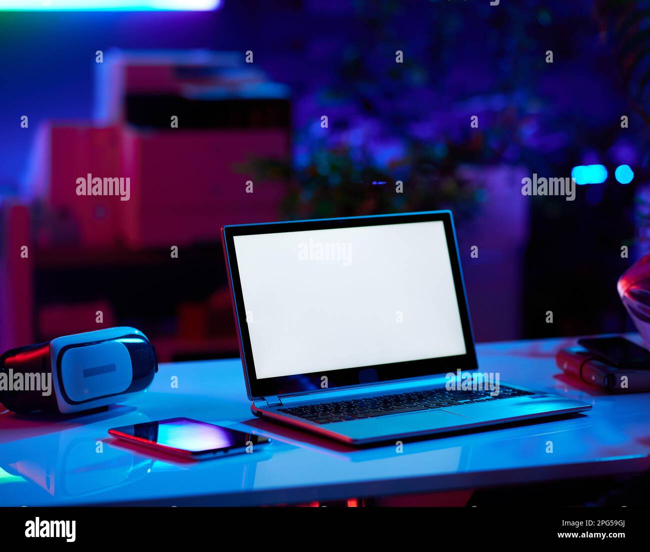 Neon metaverse futuristic concept. modern office with table, tablet PC ...