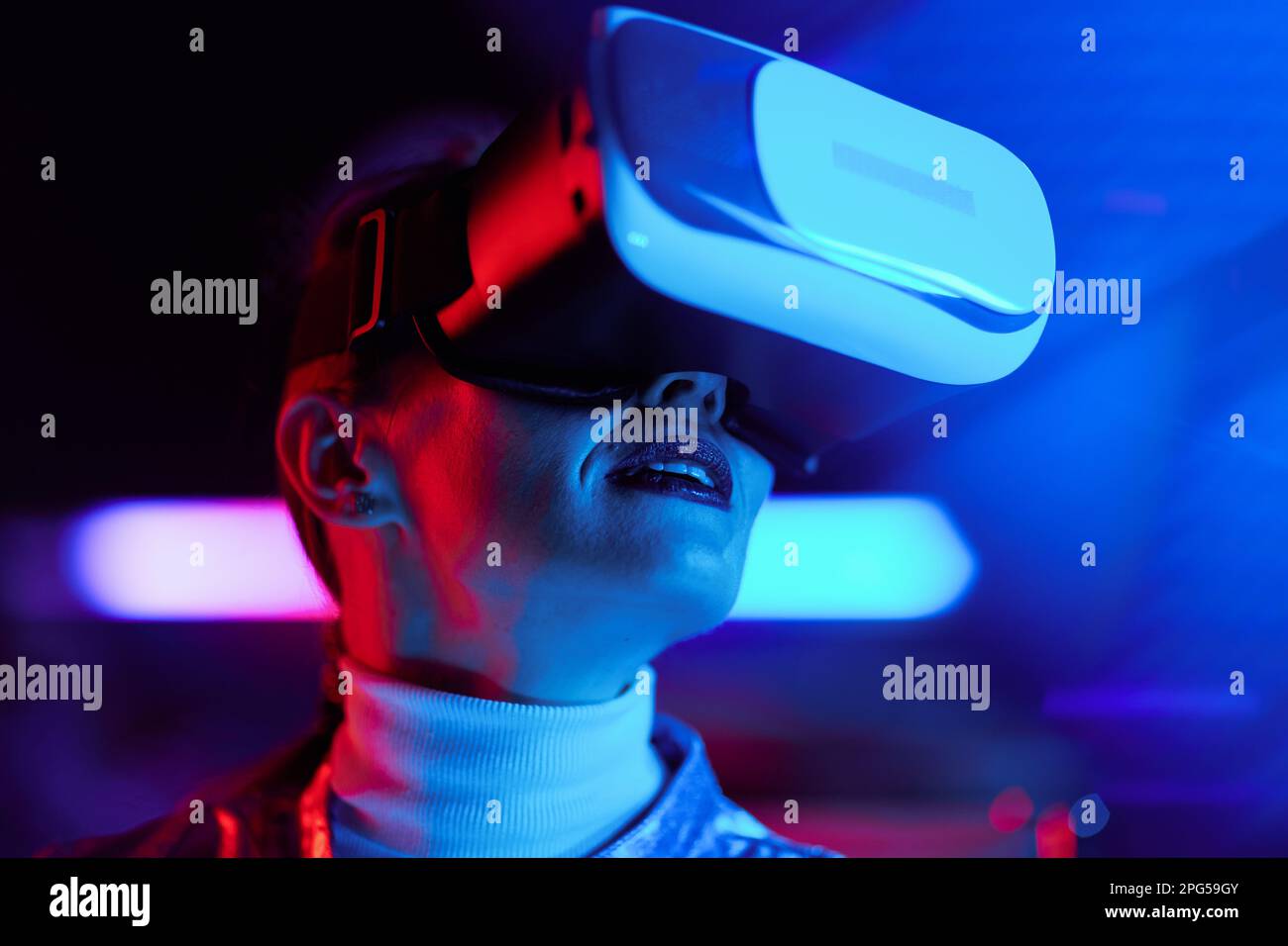 Neon metaverse futuristic concept. Portrait of modern middle aged woman ...